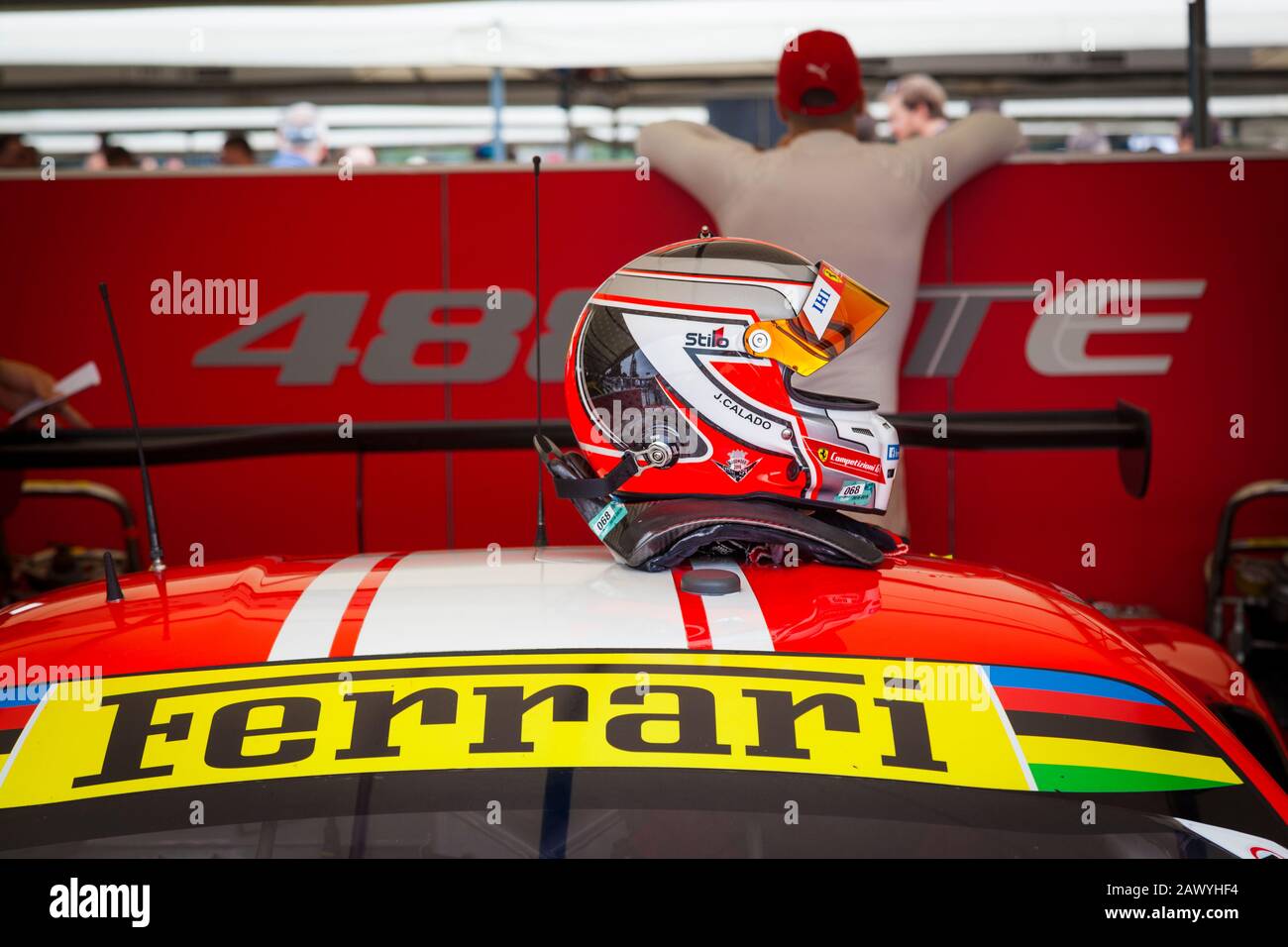 Racing helmet of British driver James Calado on the roof of a Ferrari ...