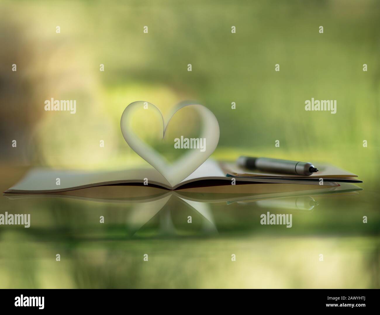 Notebook pages forming heart shape Stock Photo - Alamy