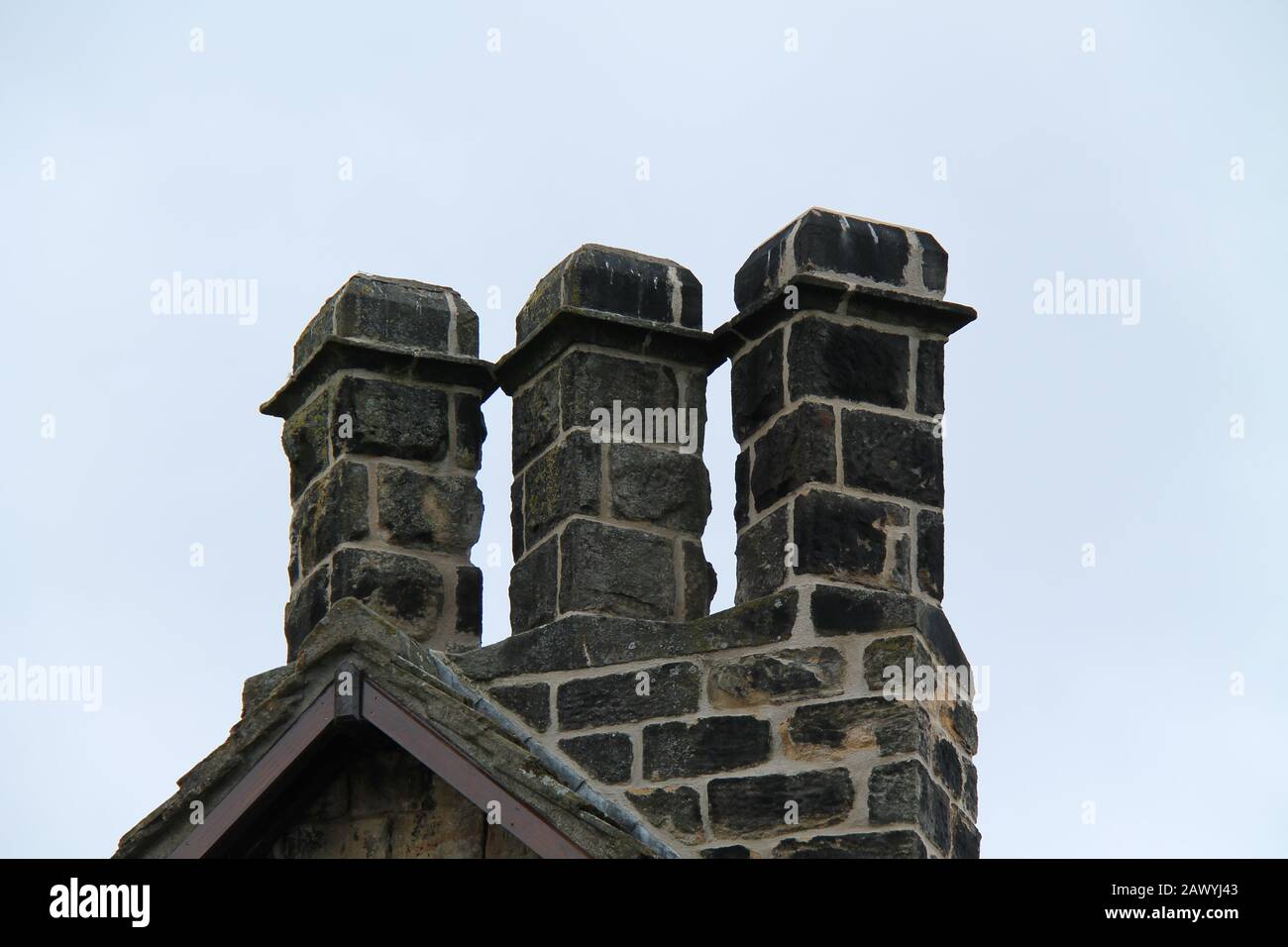 A Set of Three Stone Chimneys on a Rural Cottage Stock Photo - Alamy