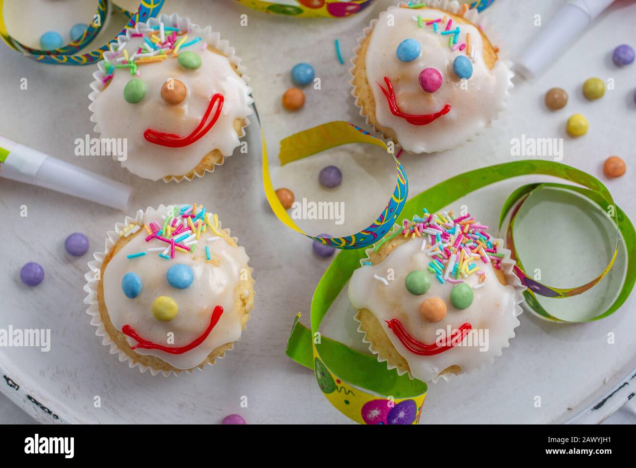 carnival clown muffins decorated with multi colored chocolate lentils ...