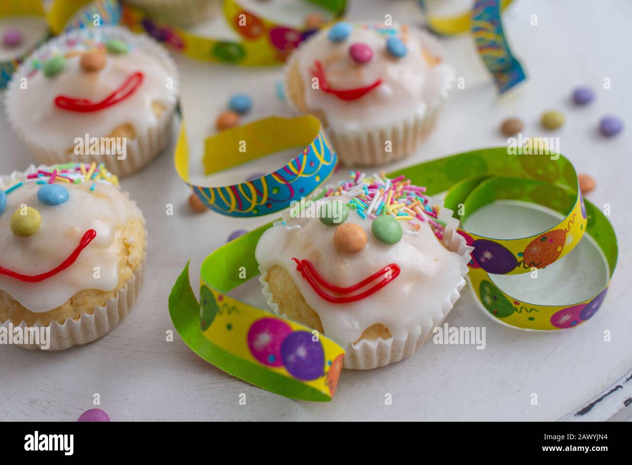 carnival clown muffins decorated with multi colored chocolate lentils ...