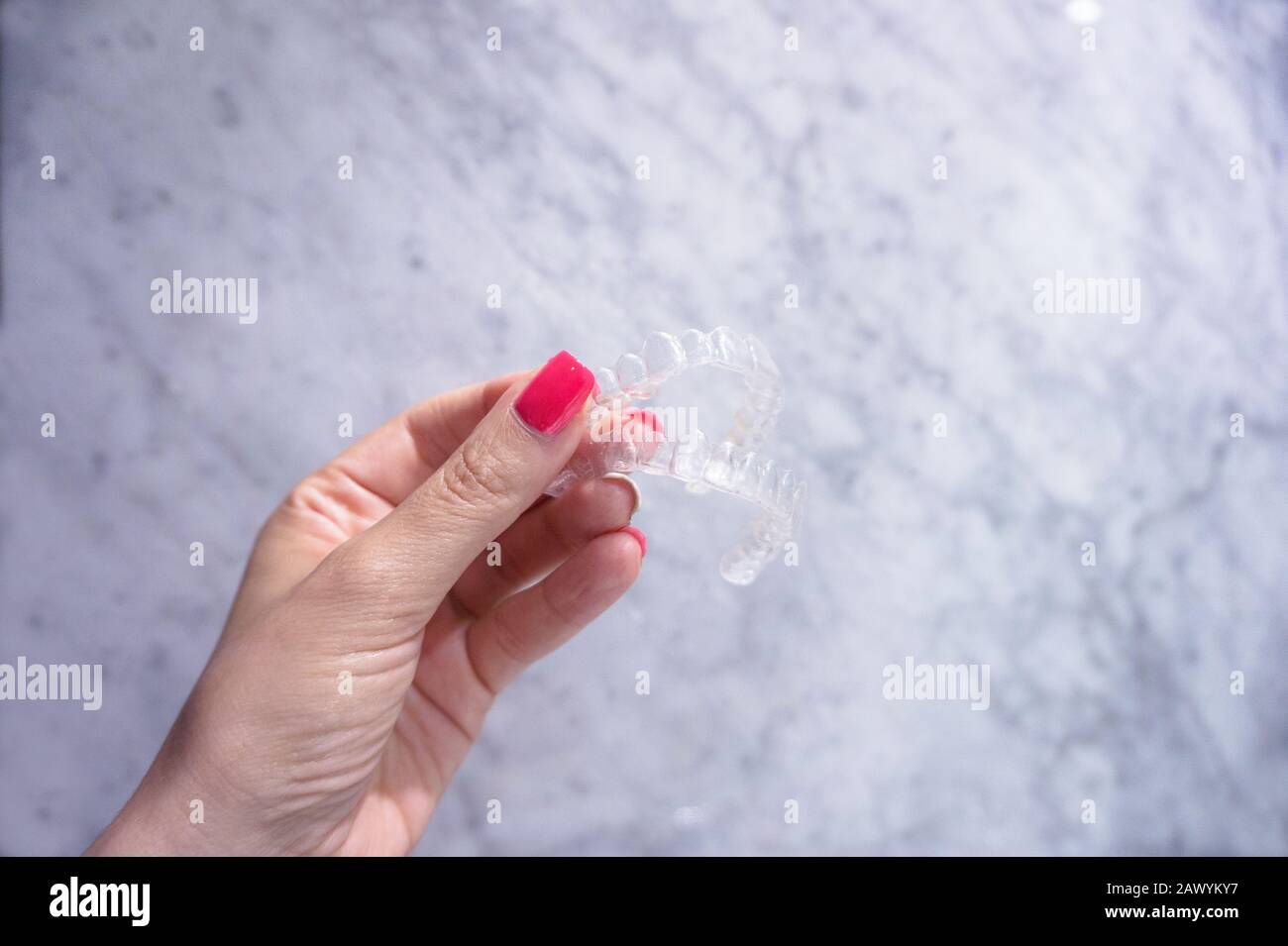 Invisible dental retainer held hi-res stock photography and images - Alamy