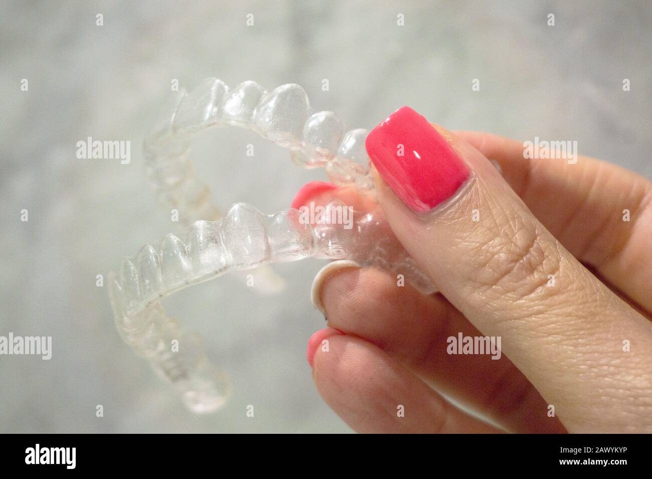 Invisible dental retainer held hi-res stock photography and images - Alamy
