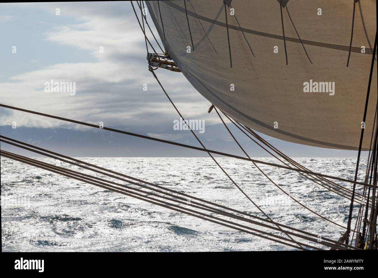 Sailboat sail and rigging over sunny Atlantic Ocean Stock Photo - Alamy