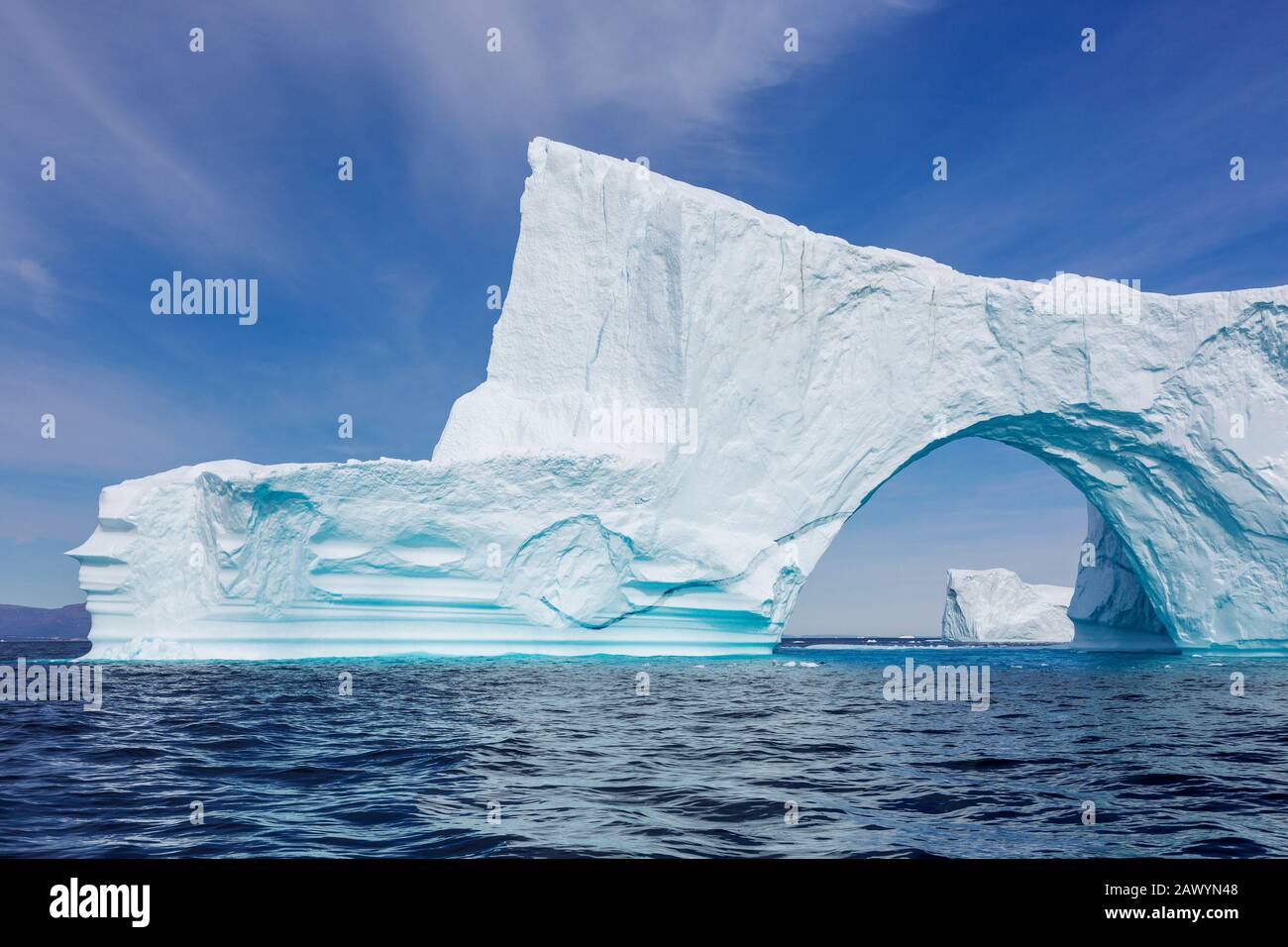 Majestic iceberg arch over sunny Atlantic Ocean Greenland Stock Photo ...
