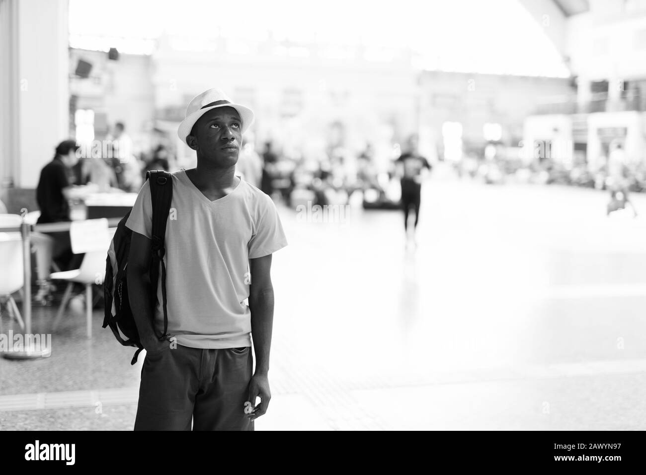 Young African tourist man thinking inside the railway station Stock ...