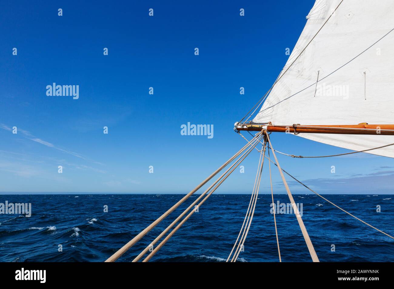 Sailboat sail and mast over sunny blue Atlantic Ocean Greenland Stock ...