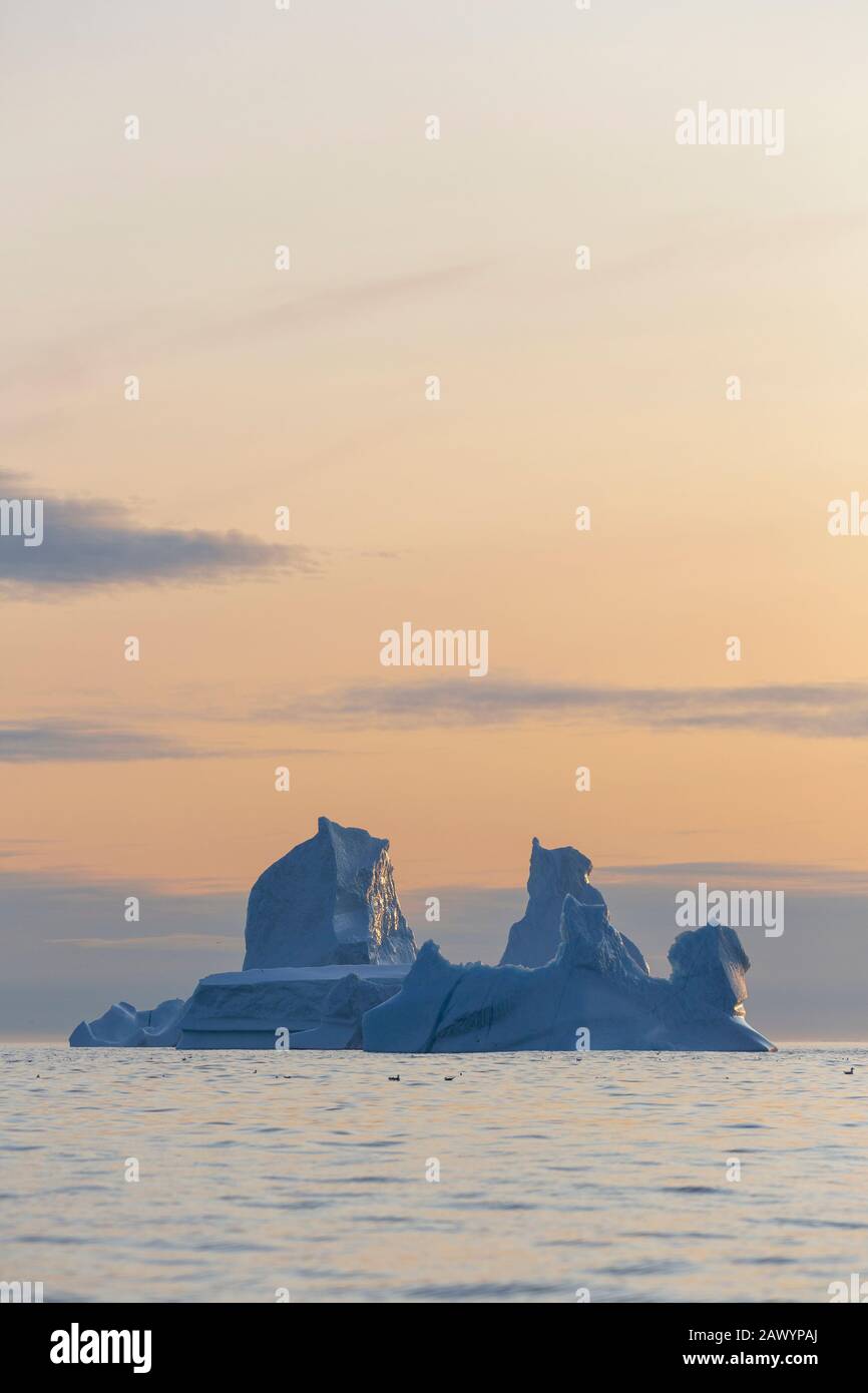 Majestic iceberg formation over sunset Atlantic Ocean Greenland Stock ...