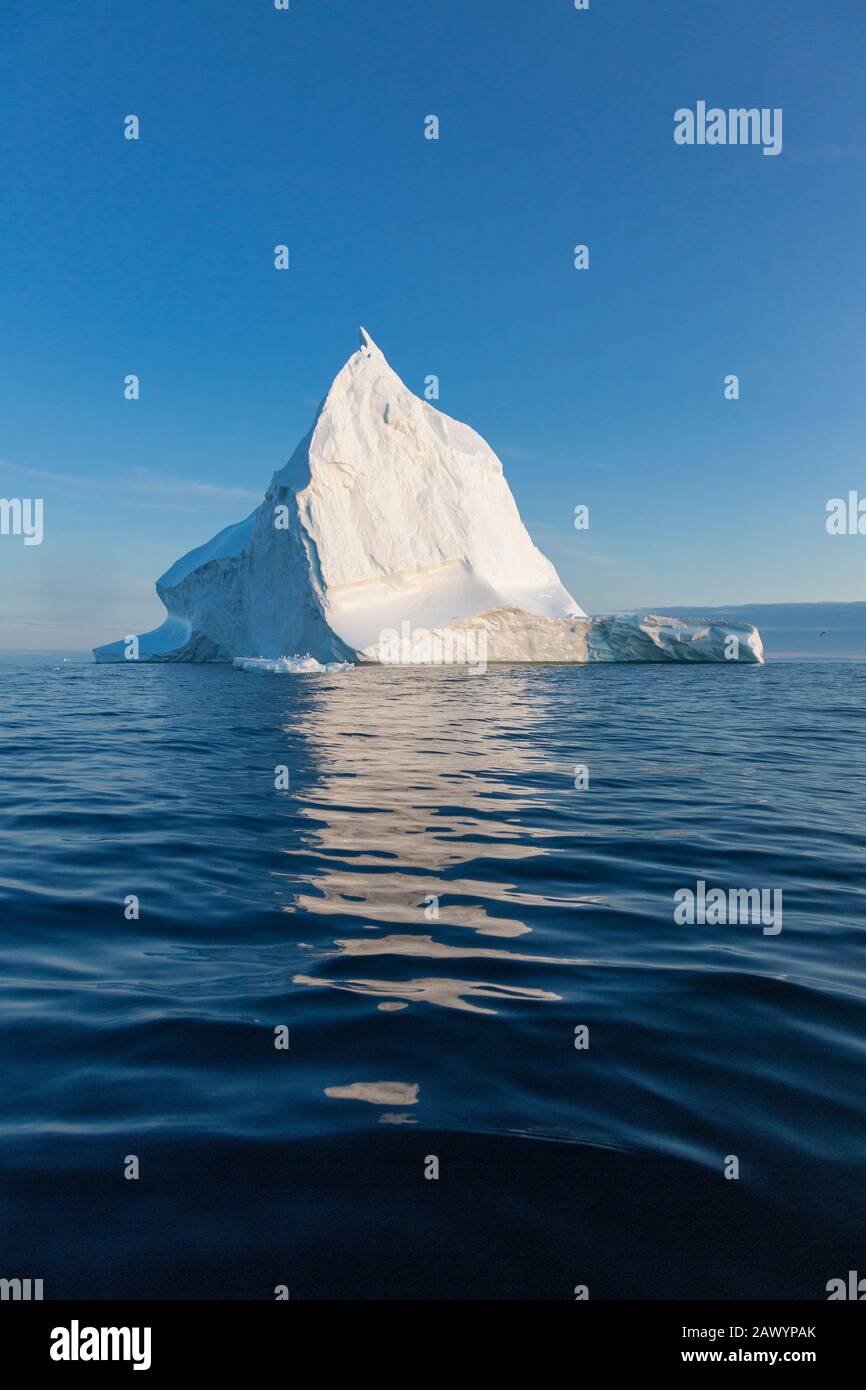Majestic iceberg formation over sunny blue Atlantic Ocean Greenland ...