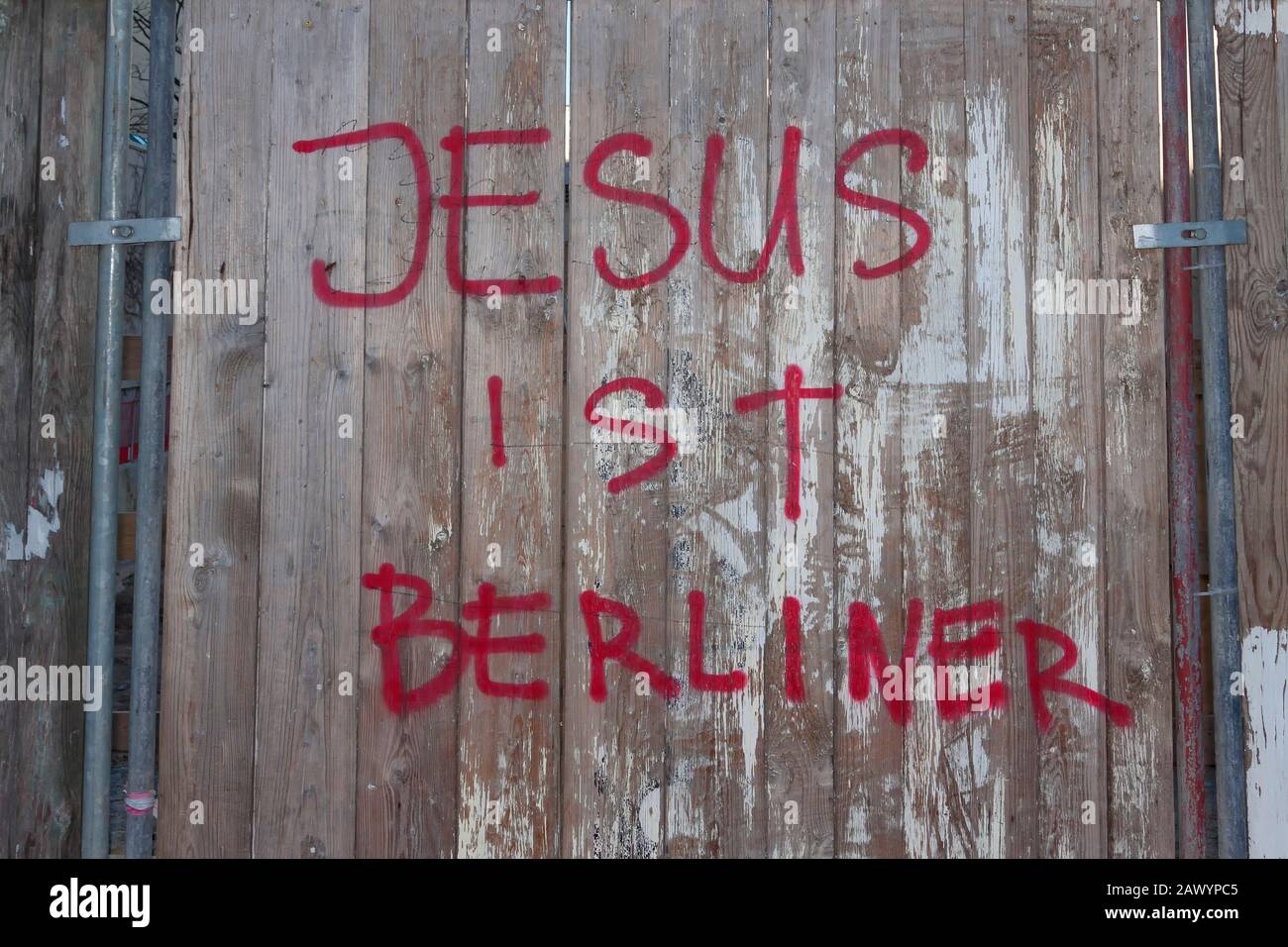 Lettering on an old wooden fence, Jesus is alive, Jesus is from Berlin ...