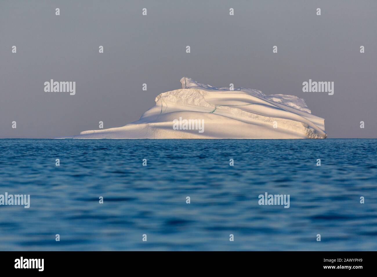 Majestic iceberg formation on sunny tranquil Atlantic Ocean Greenland ...