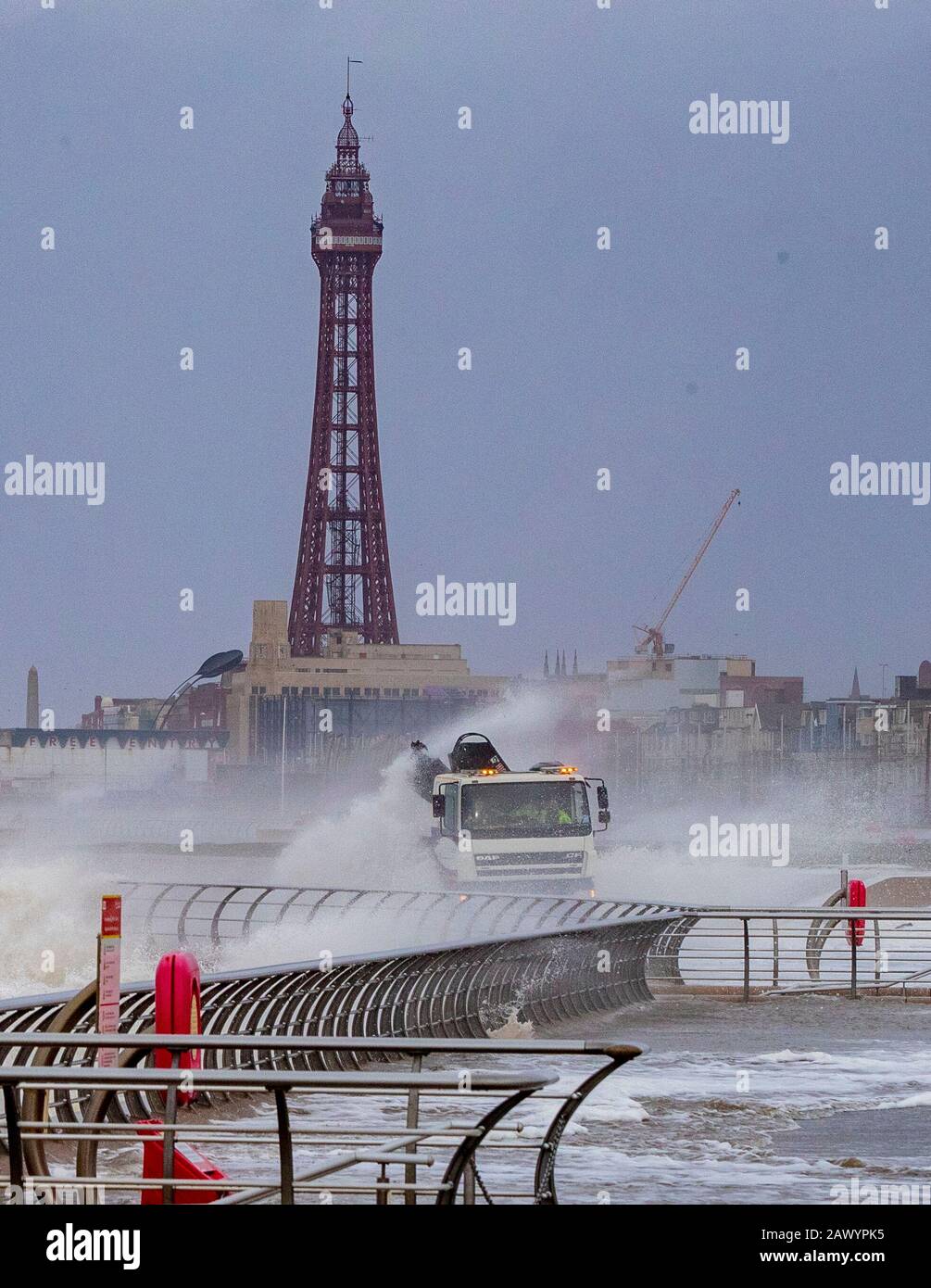 Waves crash over a lorry on Blackpool waterfront as weather warnings ...