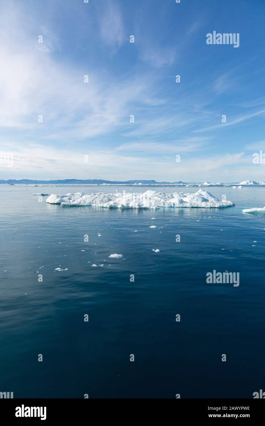 Polar ice melting on sunny blue Atlantic Ocean Greenland Stock Photo ...