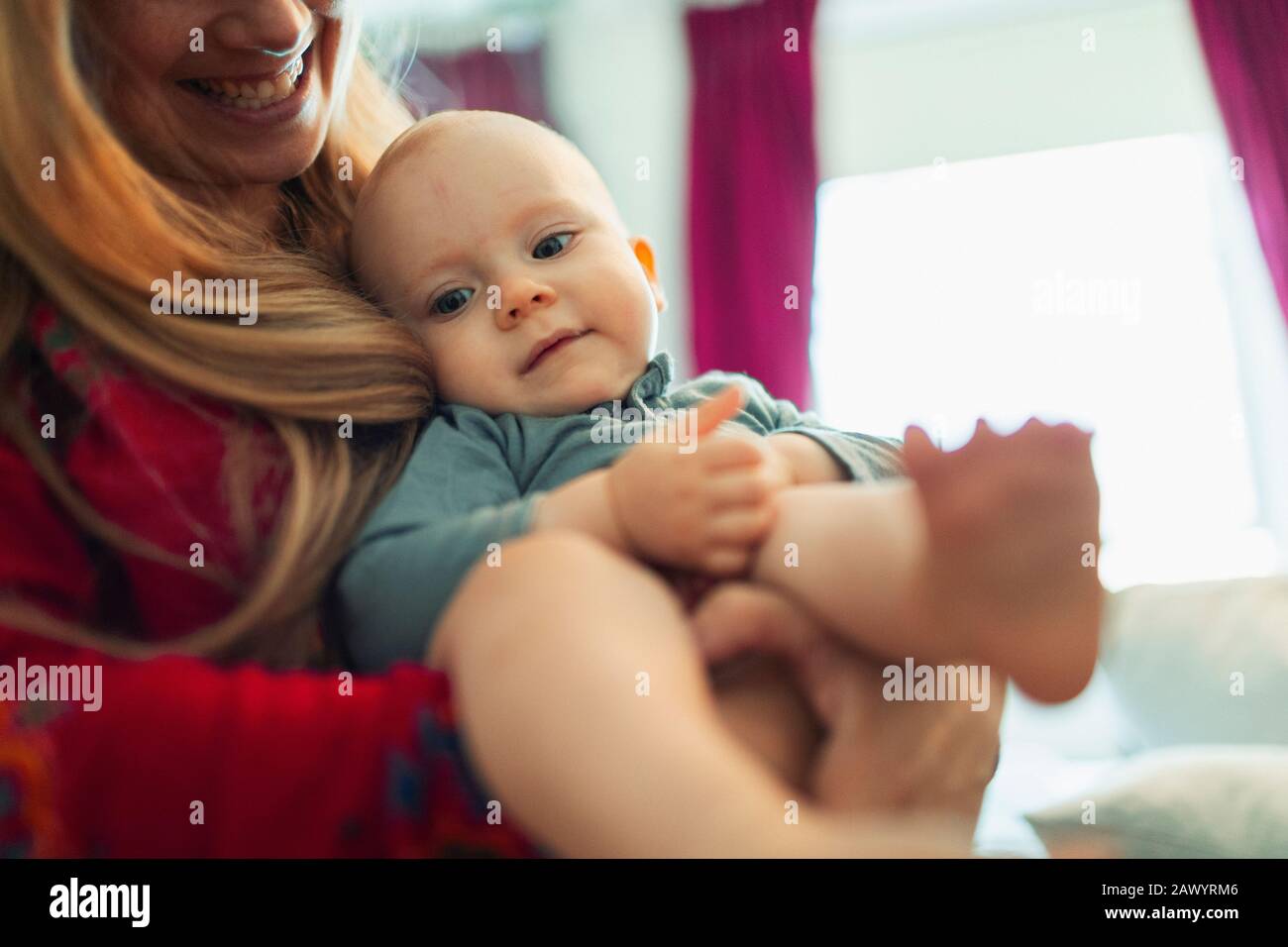 Happy mother holding cute baby daughter Stock Photo - Alamy