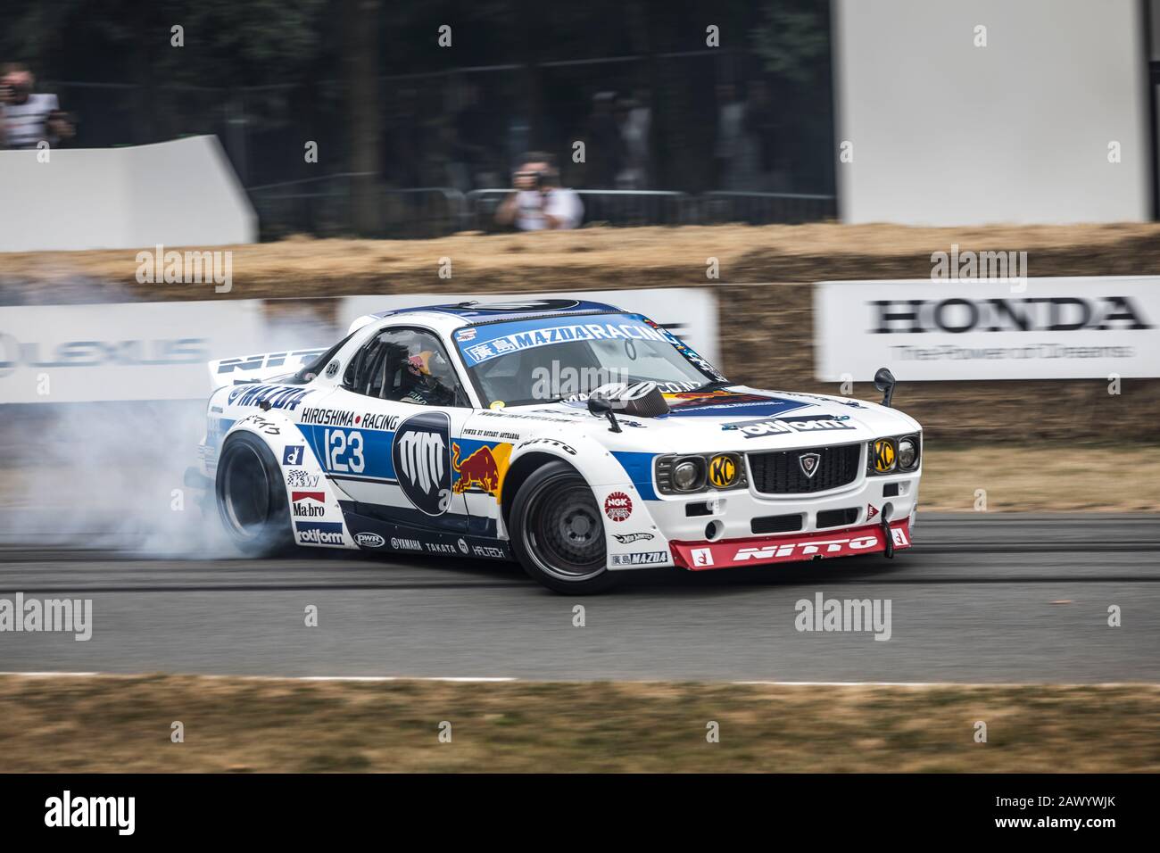 Mike Whiddett drifting a 1996 Mazda FD RX7 'MADBUL' to produce copious ...