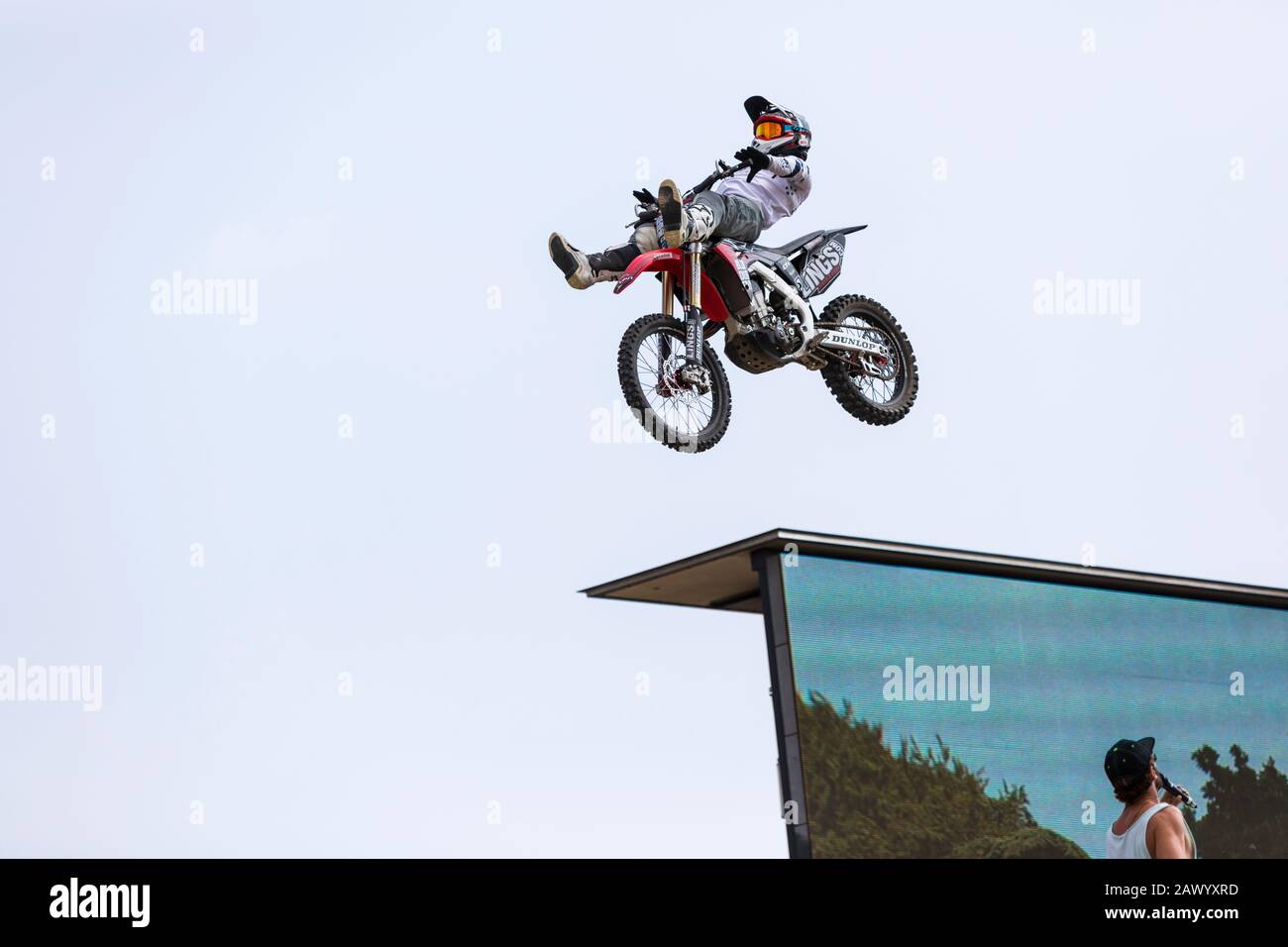 Motorcycle rider with feet and hands off hte bike during a ...
