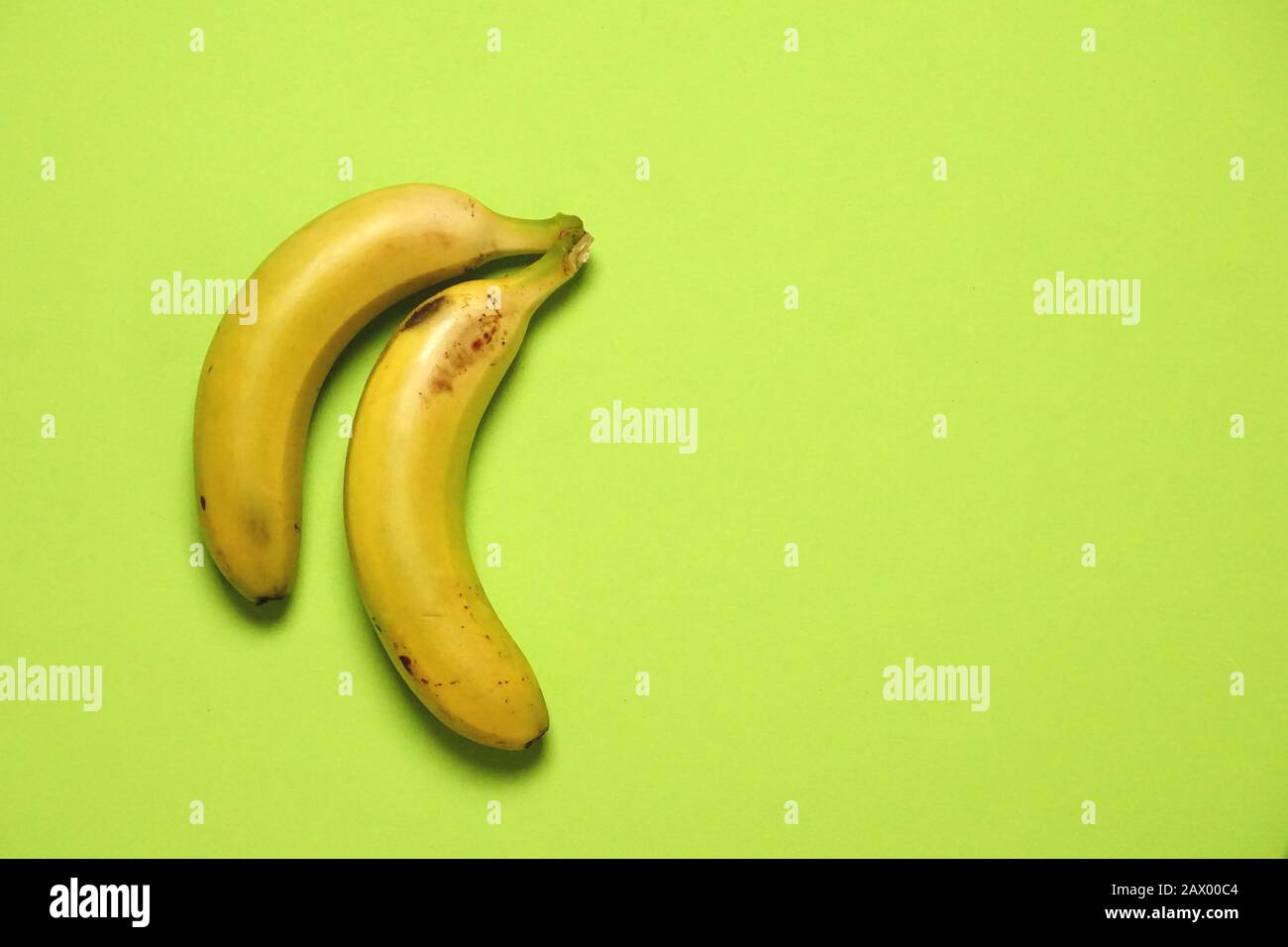 Aerial shot of delicious banana ripe fruit laid in a green surface ...