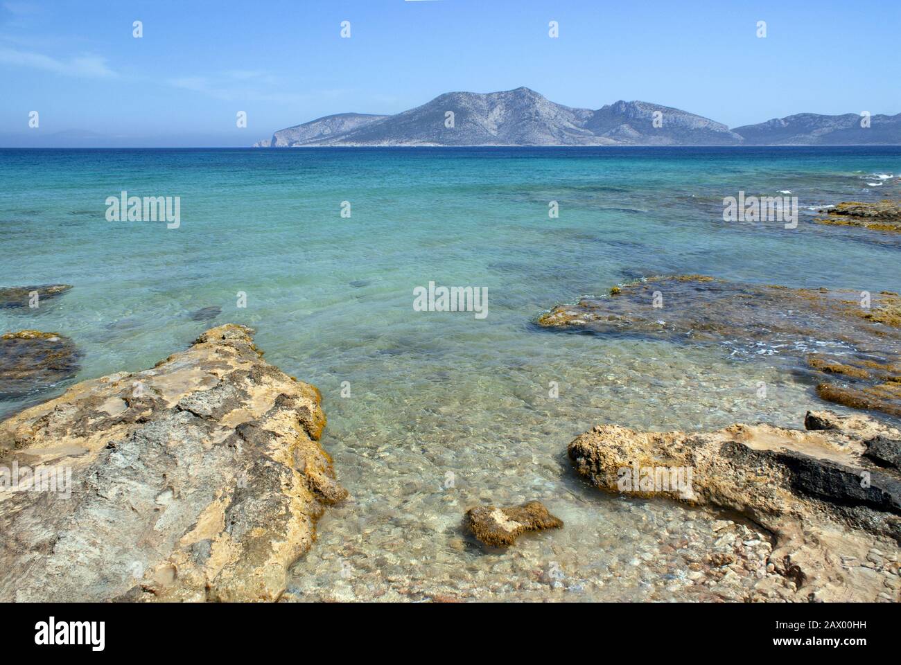 Clear blue waters at the seaside on the quiet and remote island of ...