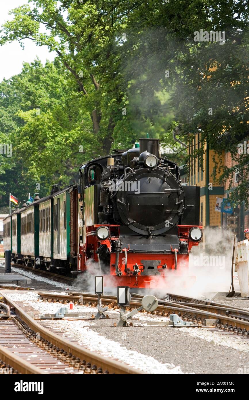 steam locomotive on rails in station Stock Photo - Alamy