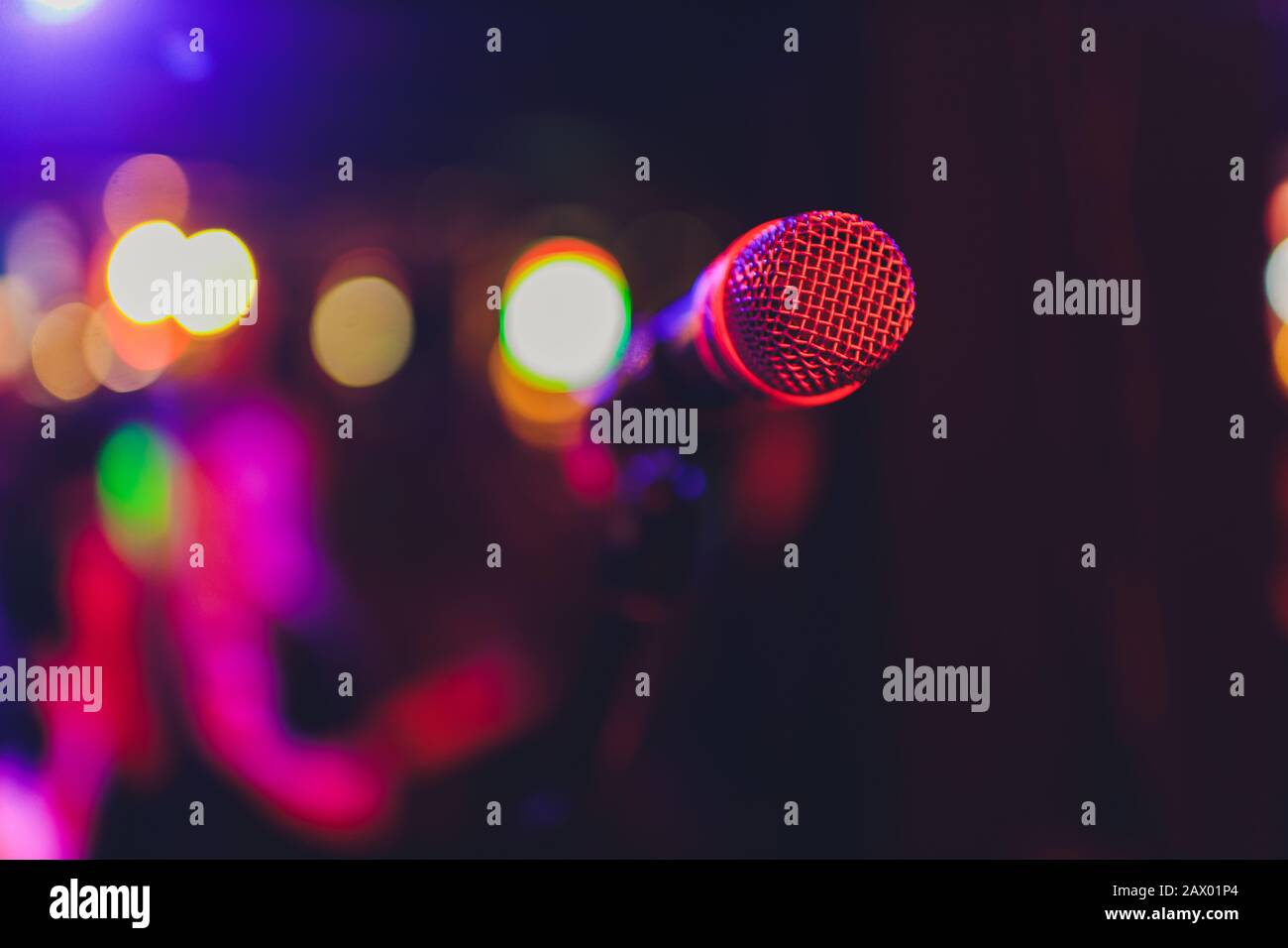 Microphone on stage in club with background Stock Photo - Alamy