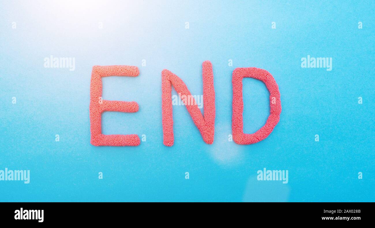 word end in red letters on a blue background Stock Photo - Alamy