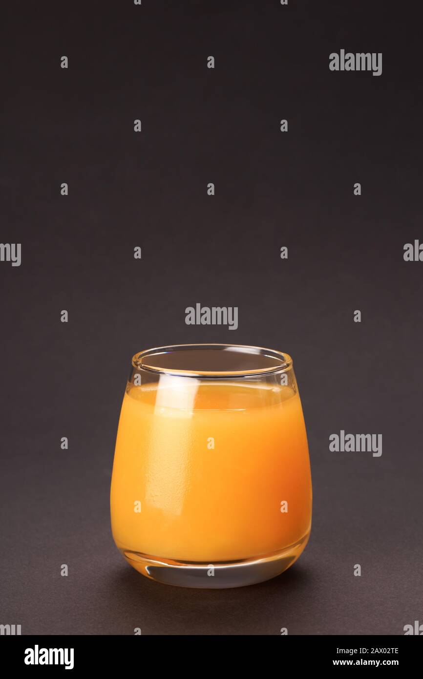 Orange juiceover blue background. Food supplement concept Stock Photo ...