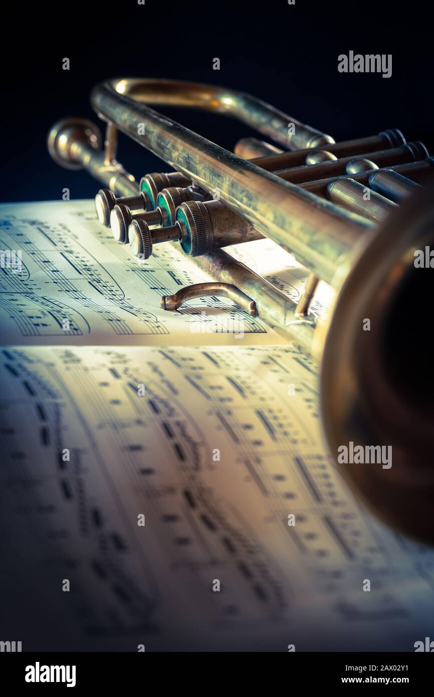 trumpet on sheet music - close up Stock Photo - Alamy