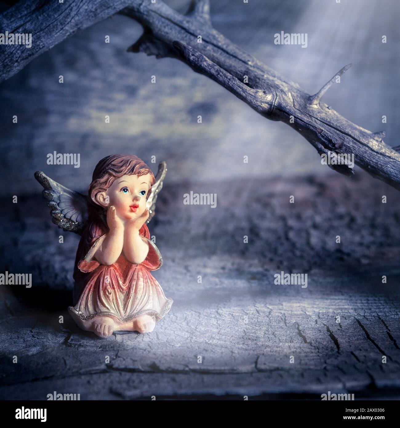little angel sitting in meditation Stock Photo - Alamy