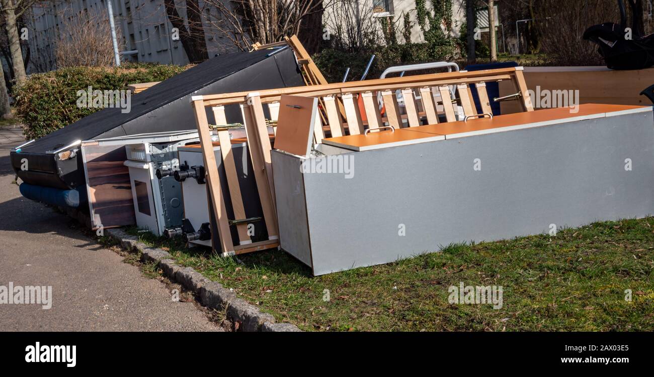 Panoramic bulky waste on the roadside Stock Photo - Alamy