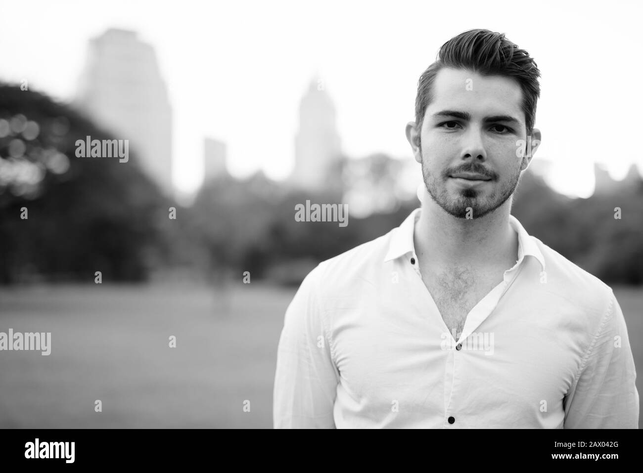 Face of young handsome man relaxing at the park Stock Photo - Alamy