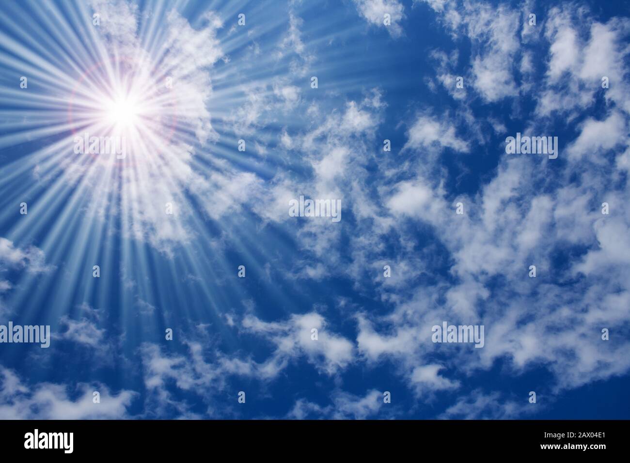 Bright shining sun on a summer day with blue sky and fluffy clouds ...