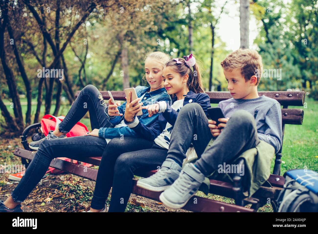 Child concentrating smartphone hi-res stock photography and images - Alamy