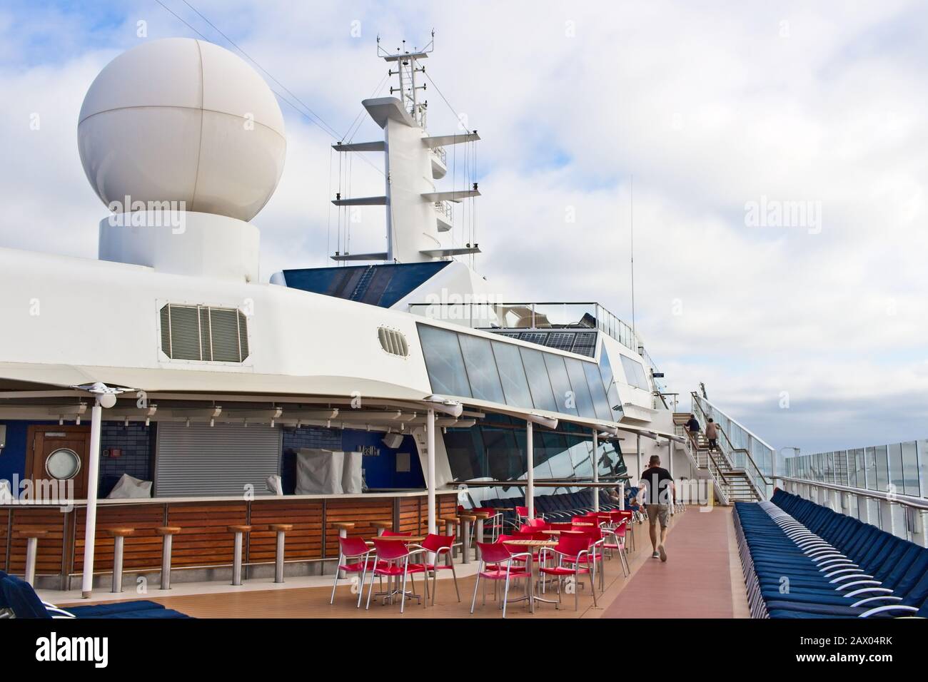 White cruise ship with a cafe on its deck Stock Photo - Alamy