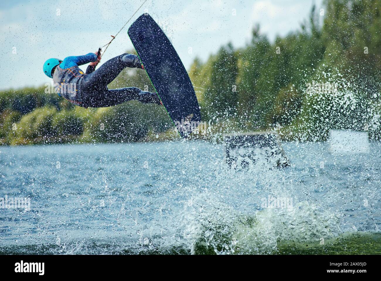 Wakeboarder making tricks wakeboarding hi-res stock photography and ...
