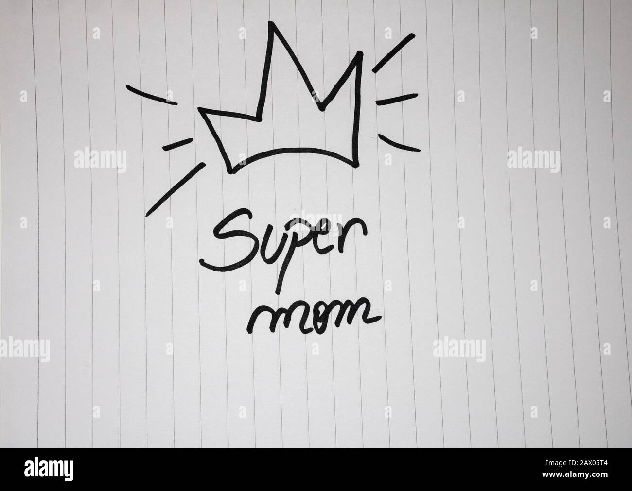 Crown drawing and super mom writing love text for mother on paper ...