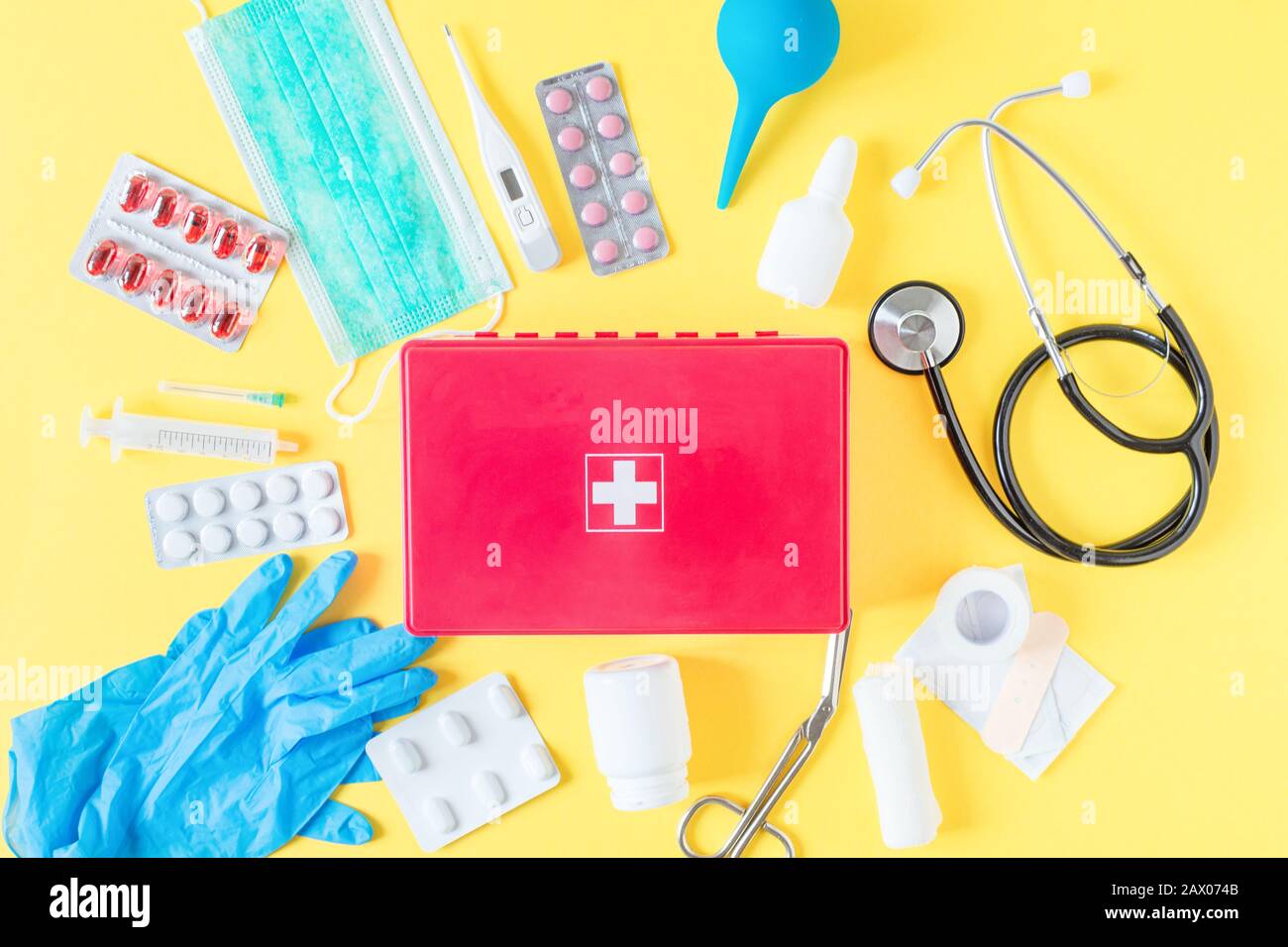 First aid kit red box with medical equipment and medications for ...
