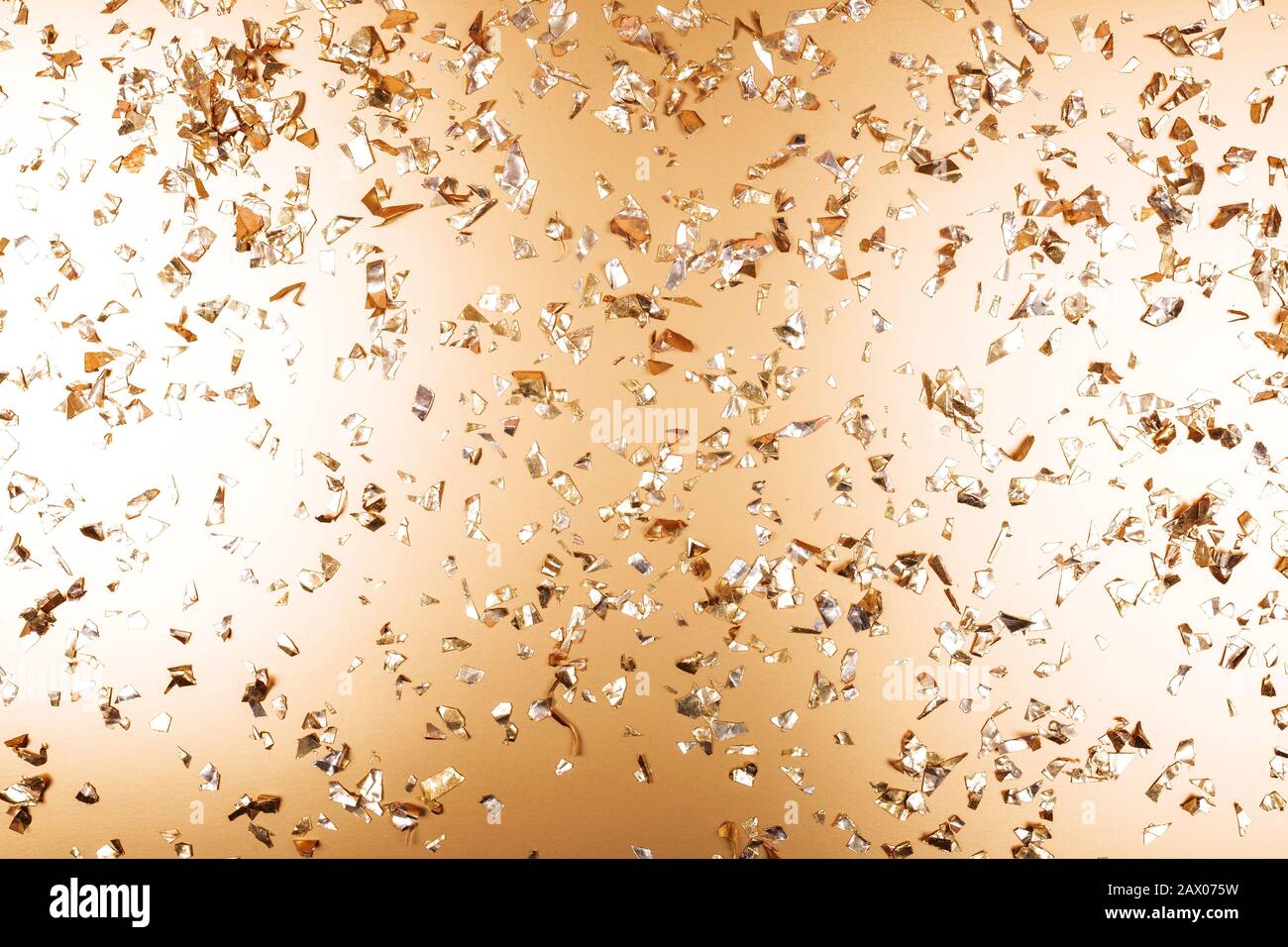 Golden metallic confetti falling hi-res stock photography and images ...