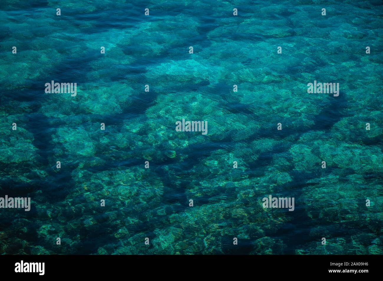 Wide angle shot of the stones underneath the ocean seen through the ...