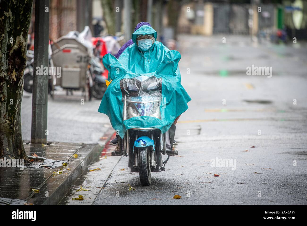 People wear face masks to protect from the growing outbreak of ...