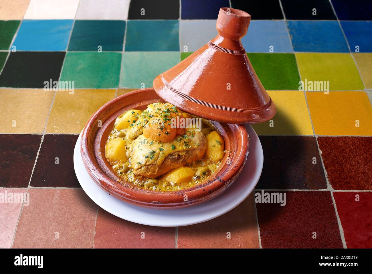 Delicious traditional moroccan chicken tajine on colorful mosaic table ...