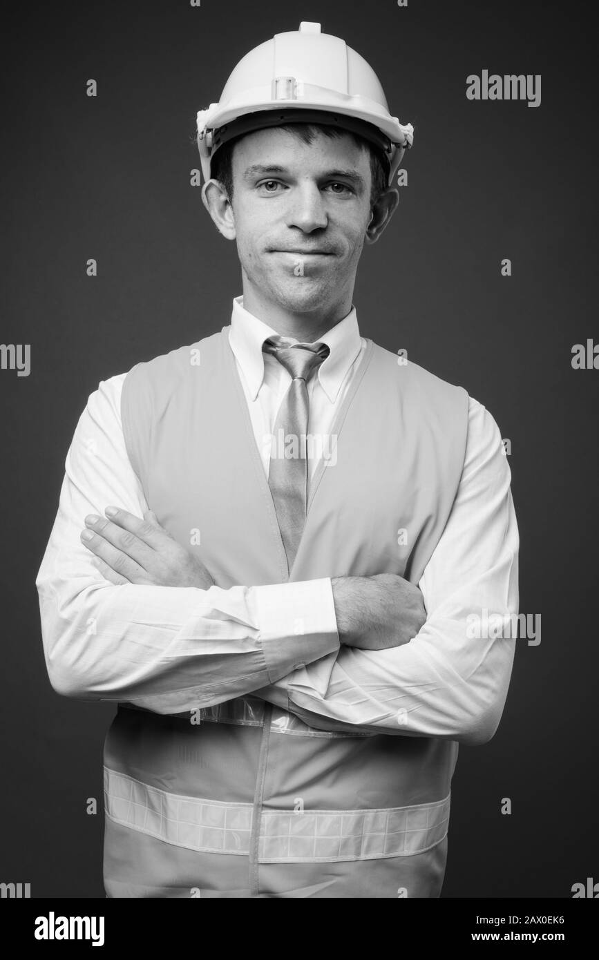 Portrait of man construction worker against gray background Stock Photo ...