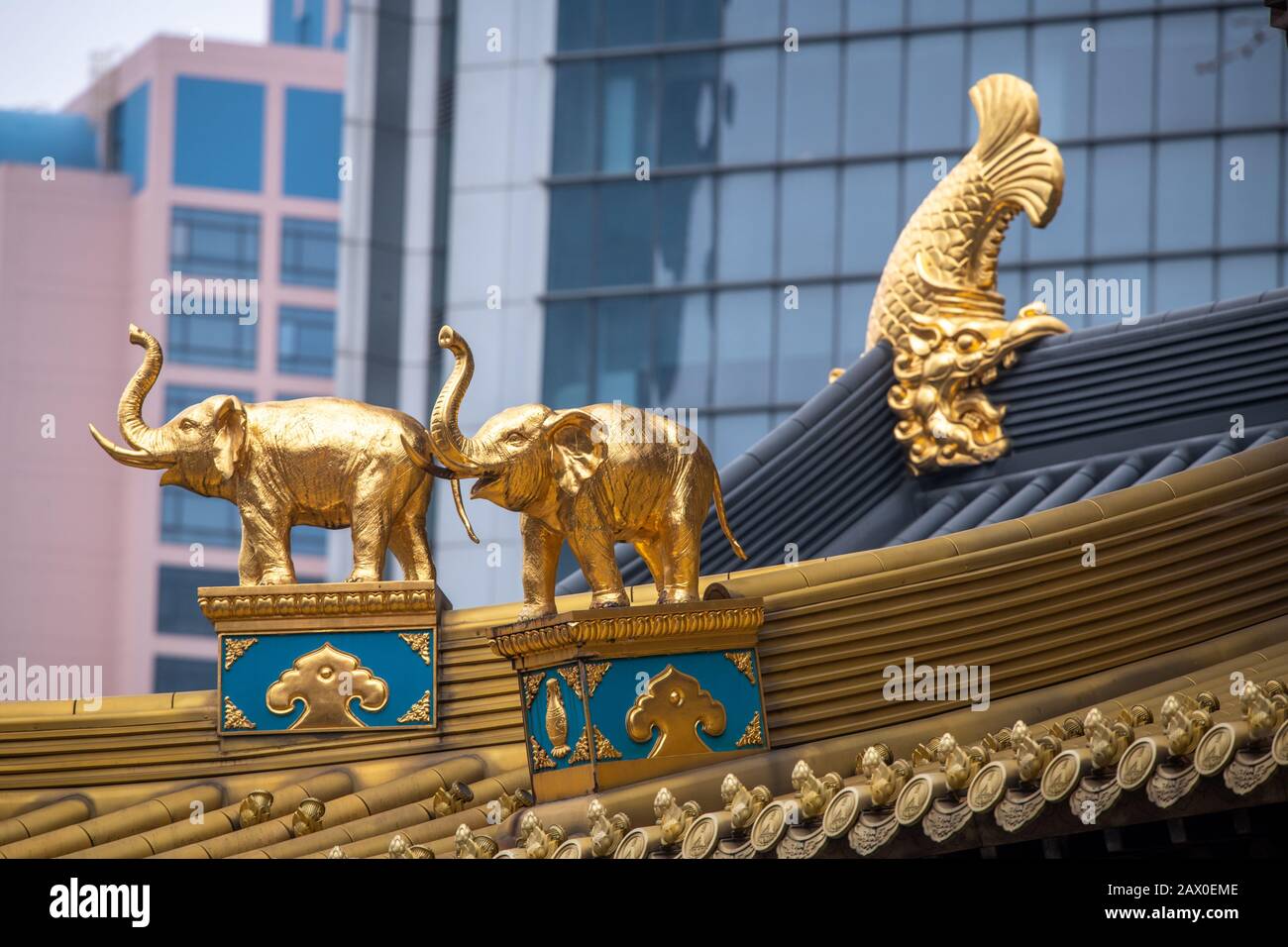 Intricate golden statues atop the Jing'an Temple , Shanghai, China ...