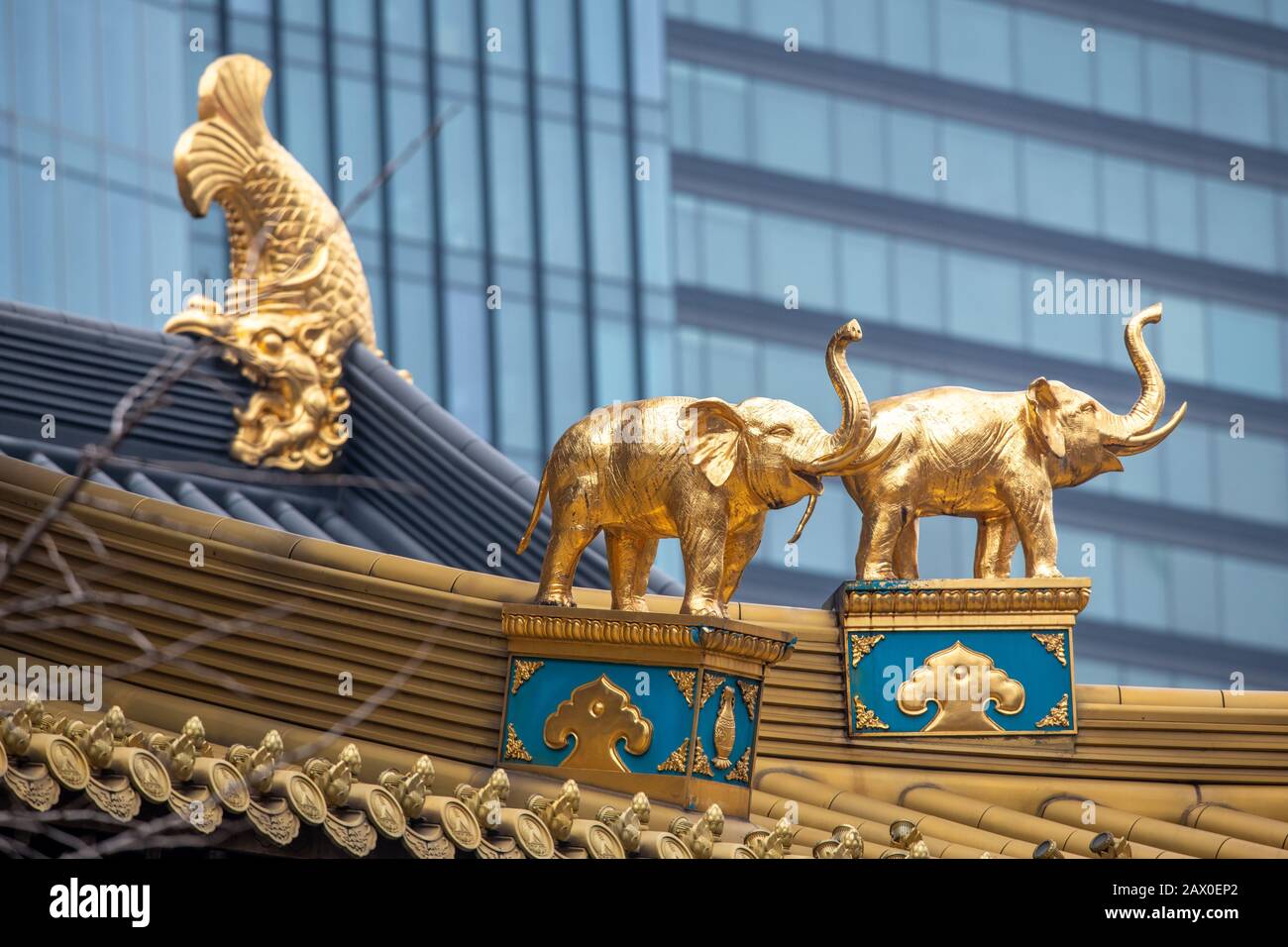 Intricate golden statues atop the Jing'an Temple , Shanghai, China ...