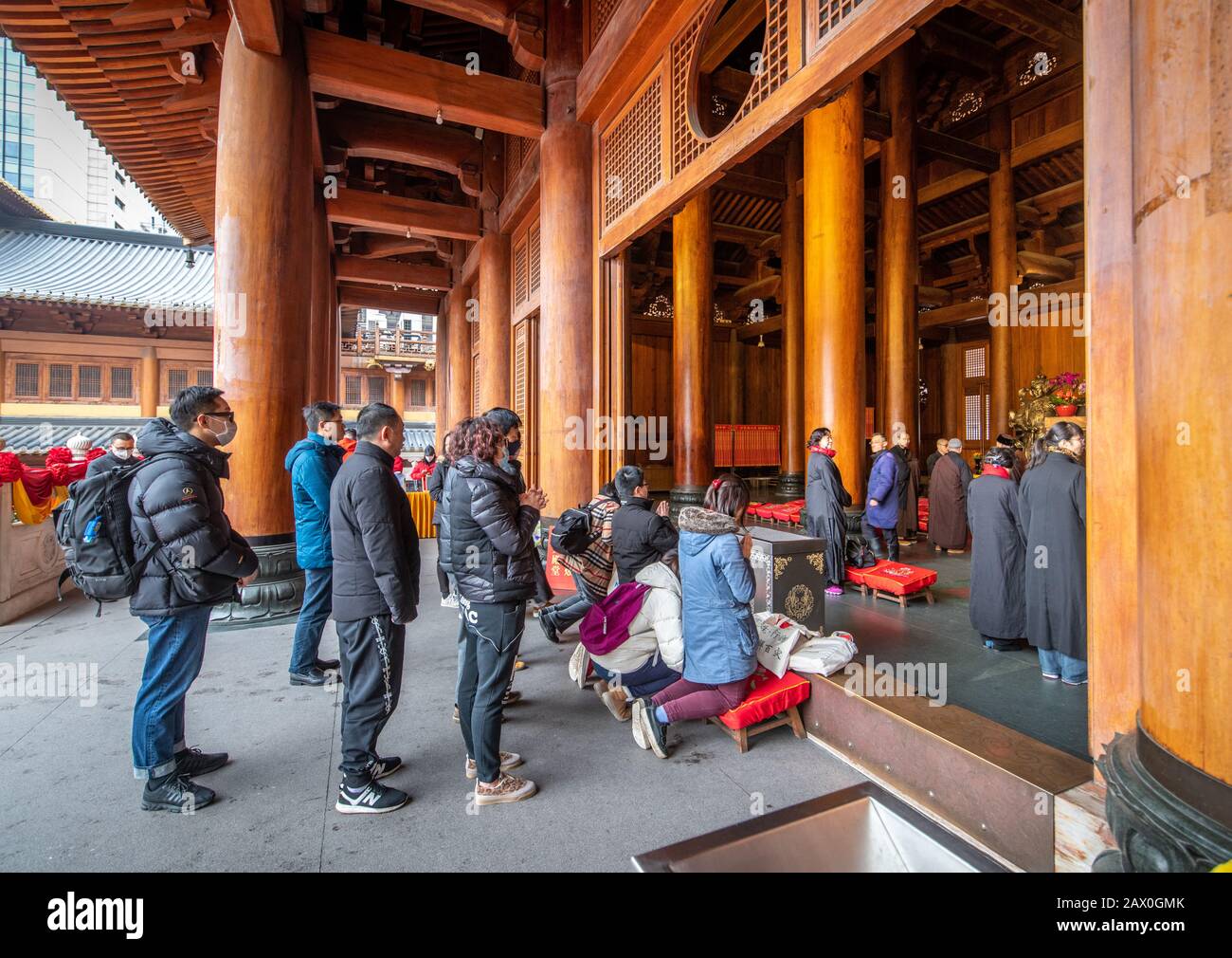 People praying at an altar in the Jing'an Temple , Shanghai, China ...
