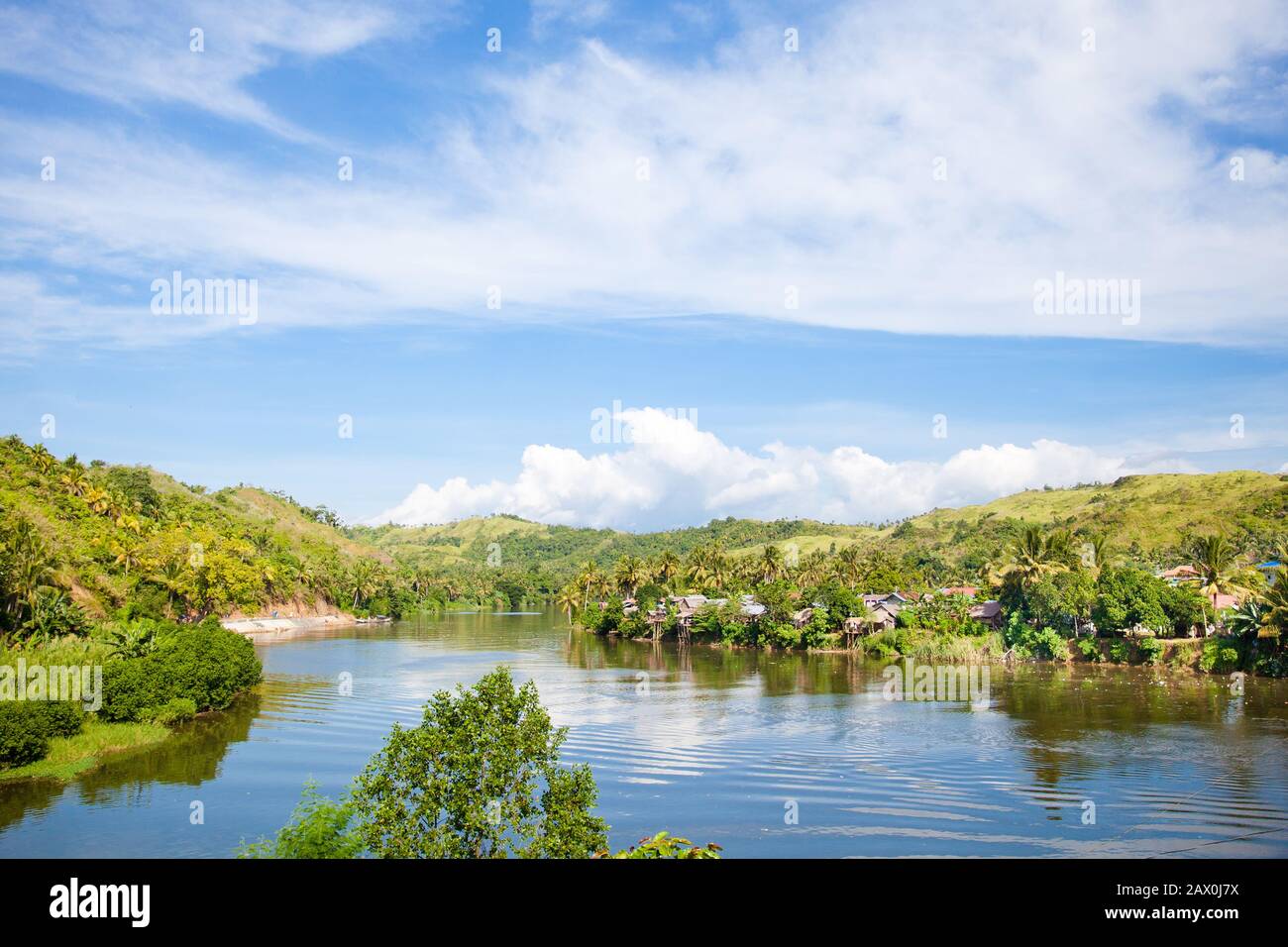 Countryside on a large tropical island. Small village on the green ...