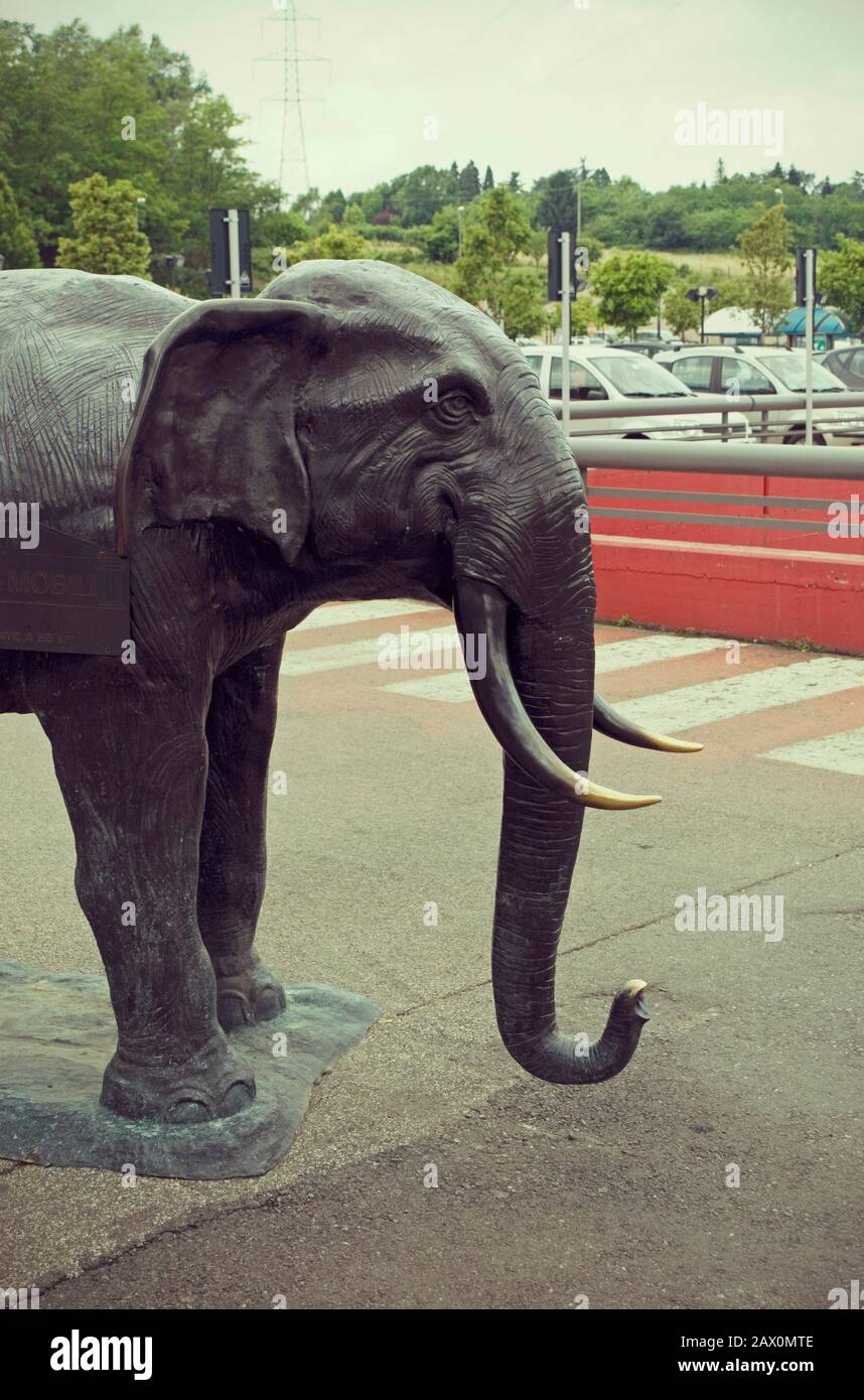 elephant metal sculpture in the parking lot of a supermarket Stock ...
