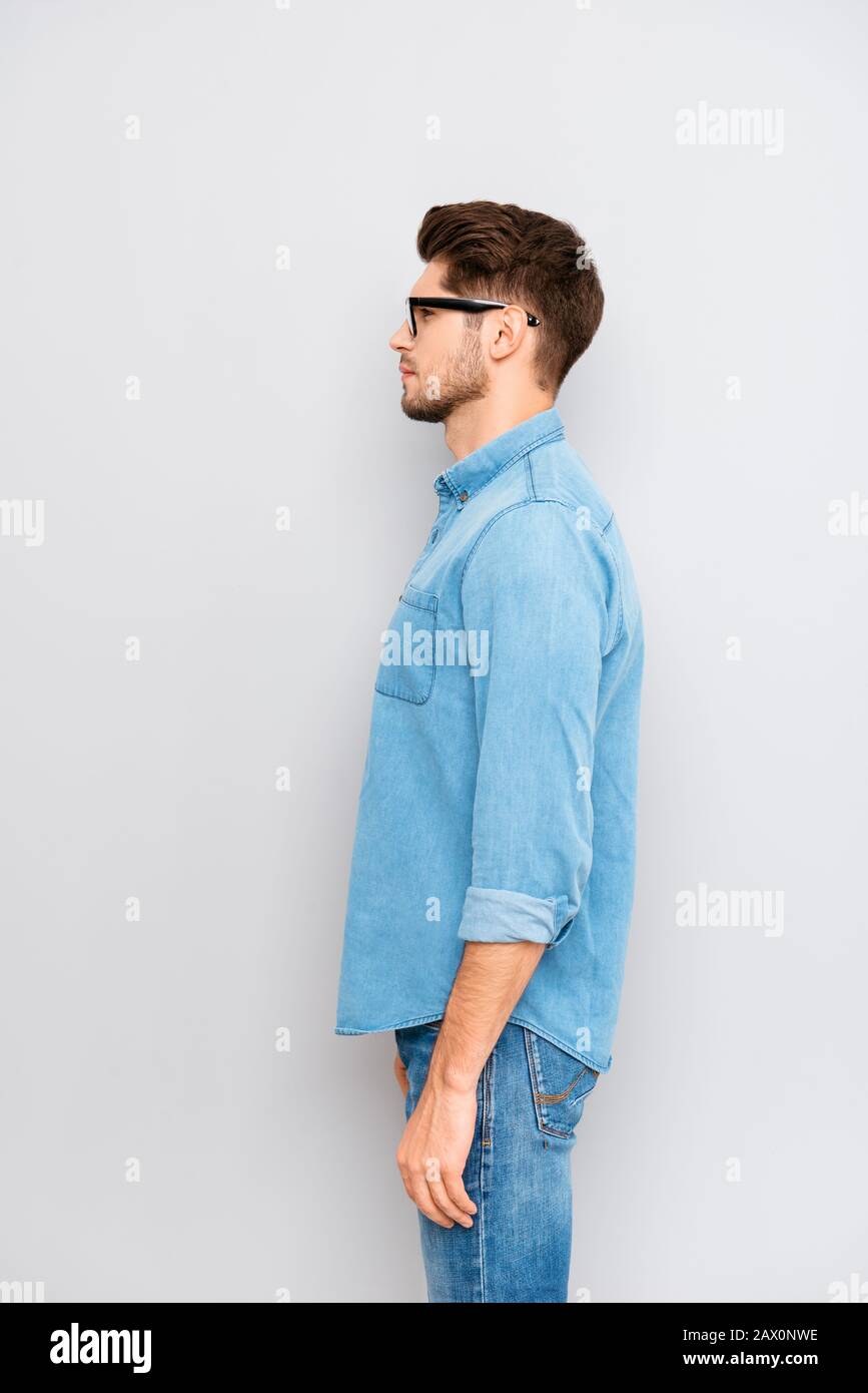 Side view portrait of young guy in glasses and blue shirt Stock Photo ...
