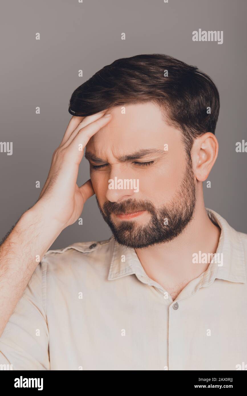 Portrait of tired depressed young man with strong headache Stock Photo ...
