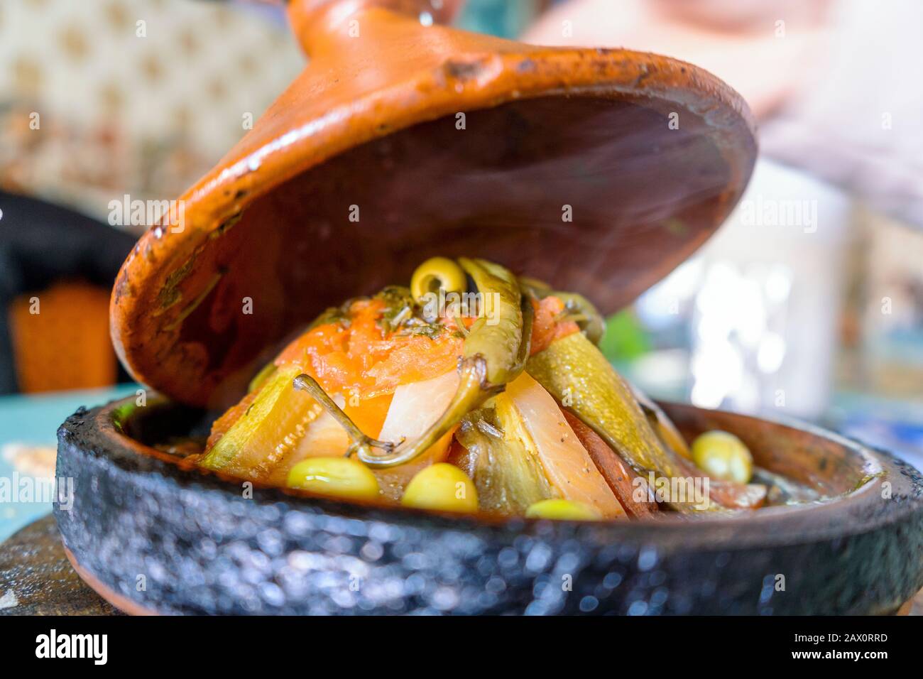 Delicious tajine served in clay pot in restaurant in Morocco Stock ...