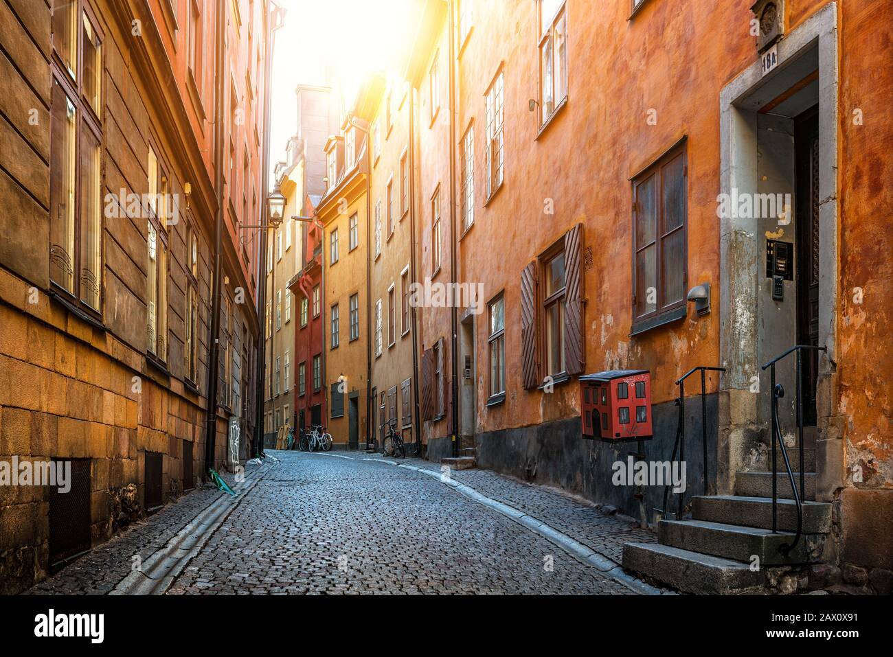 Classic view of scenic alleyway Prästgatan with traditional colorful ...